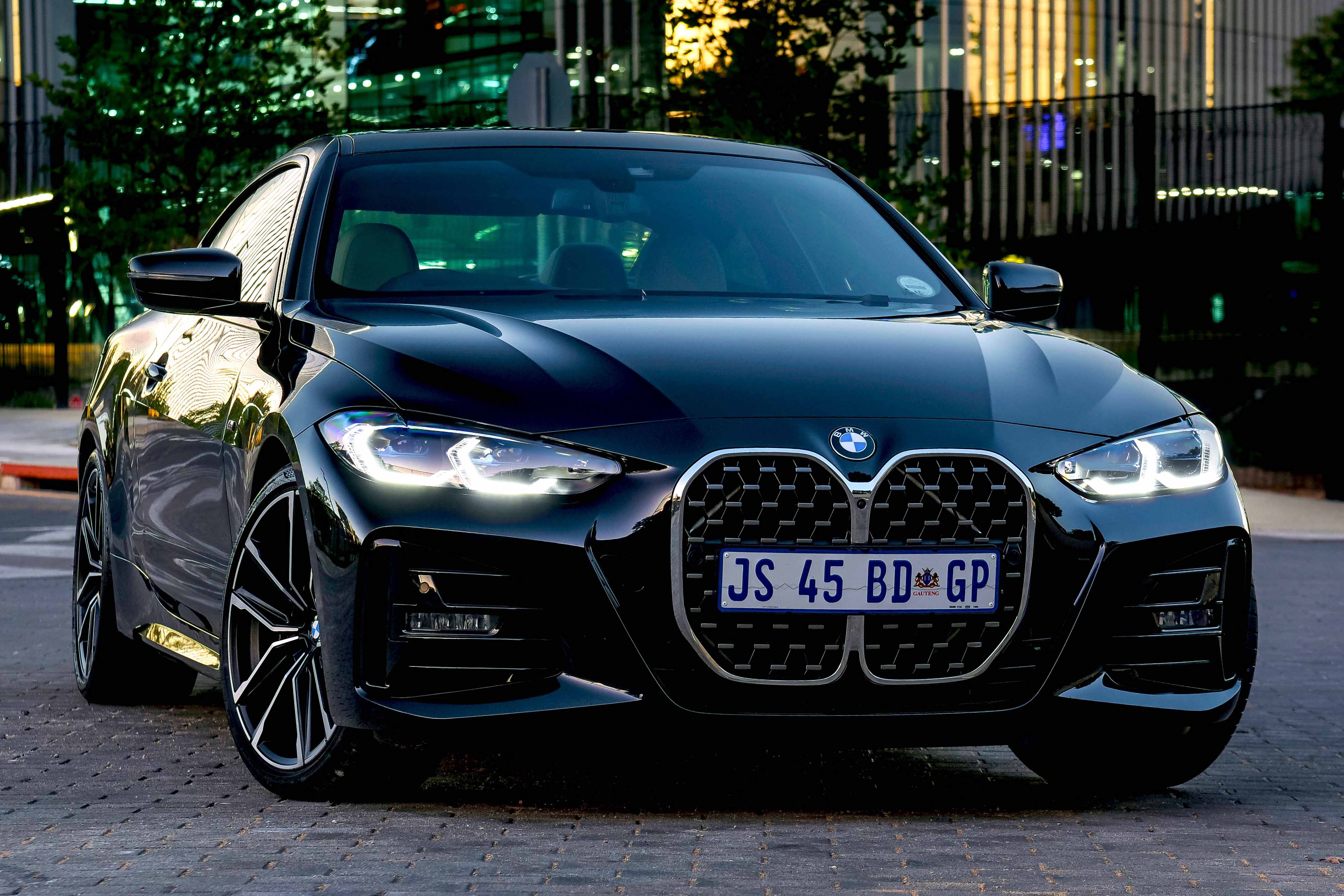 HEY, BIG MOUTH! WE DRIVE NEW BMW FOUR - Auto.